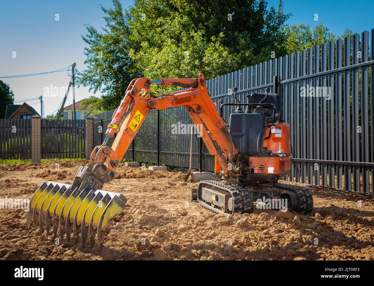 Minitractor on a working agricultural plot. Land works Stock Photo - Alamy