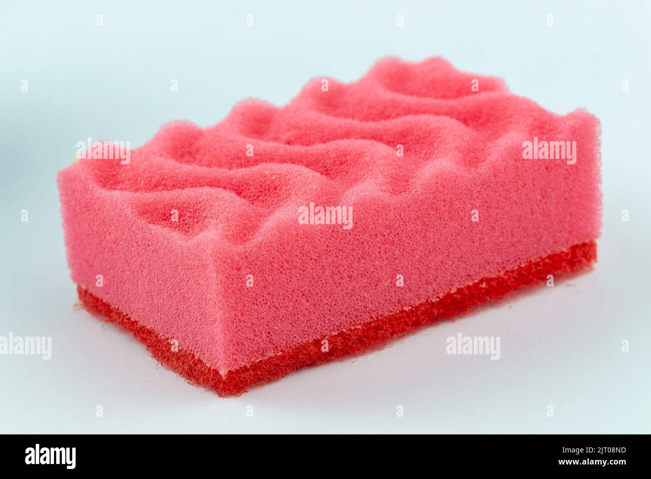 Red foam sponge for washing dishes close up on a white background Stock ...