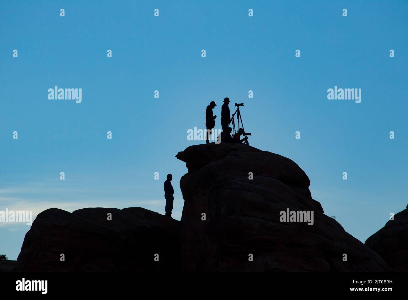 Silhouette of a group of photographers in a photo workshop taking ...