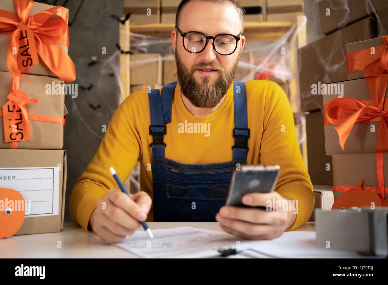 SME concept. handsome young delivery man happy with new order from ...