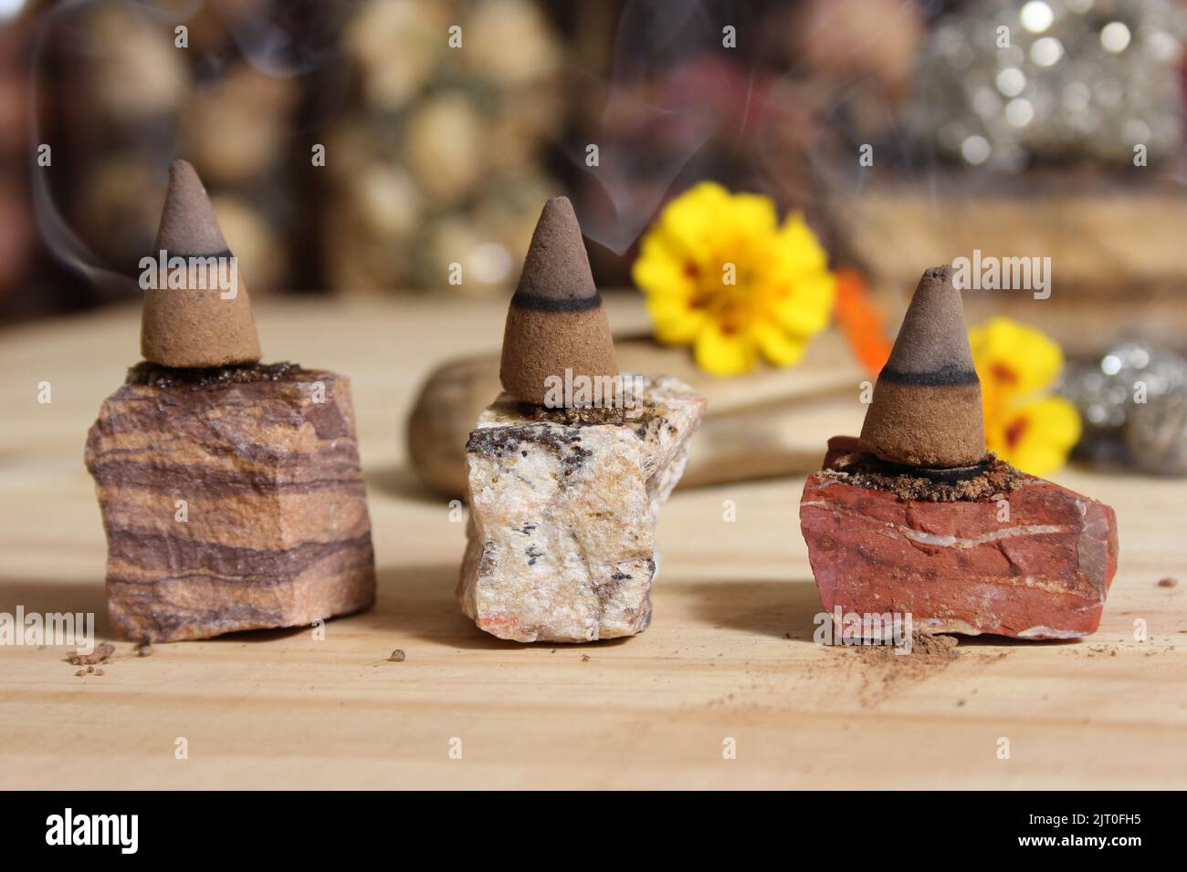 Incense Cones and Chakra Stones With Flowers in Background Stock Photo ...