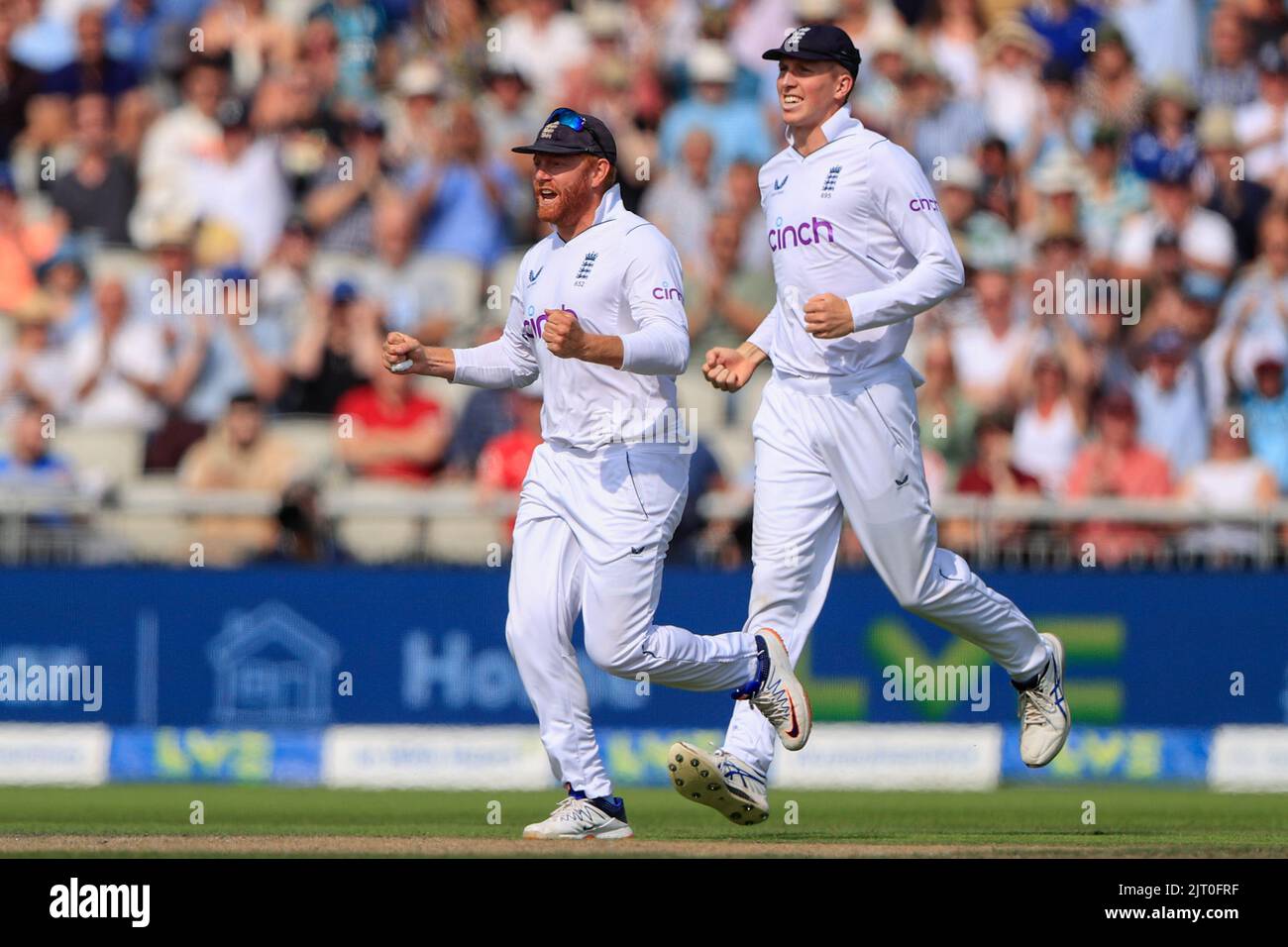 Jonny Bairstow of England and Zac Crawley of England celebrate the fall ...