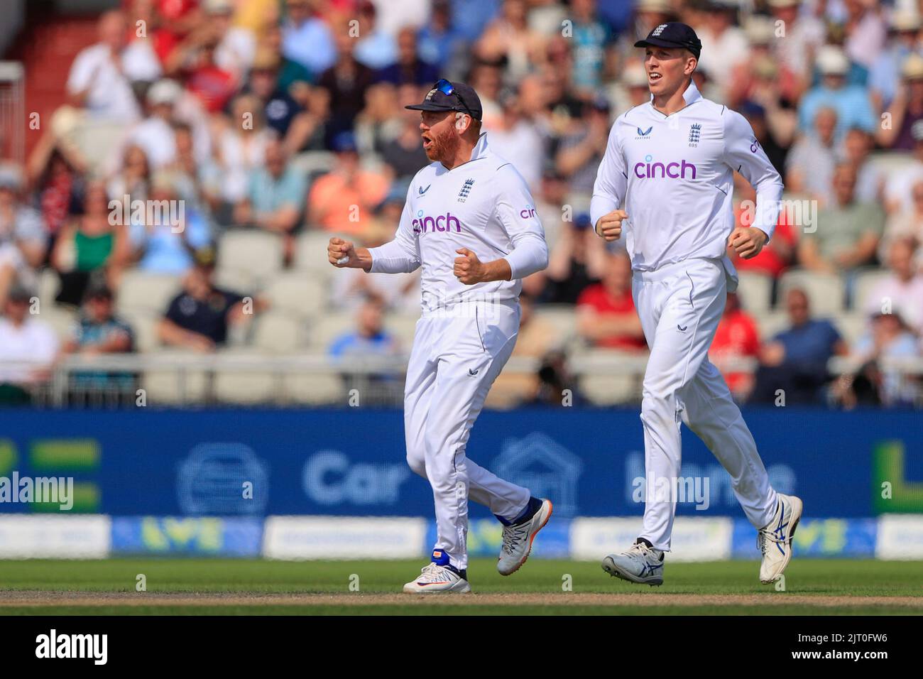 Jonny Bairstow of England and Zac Crawley of England celebrate the fall ...