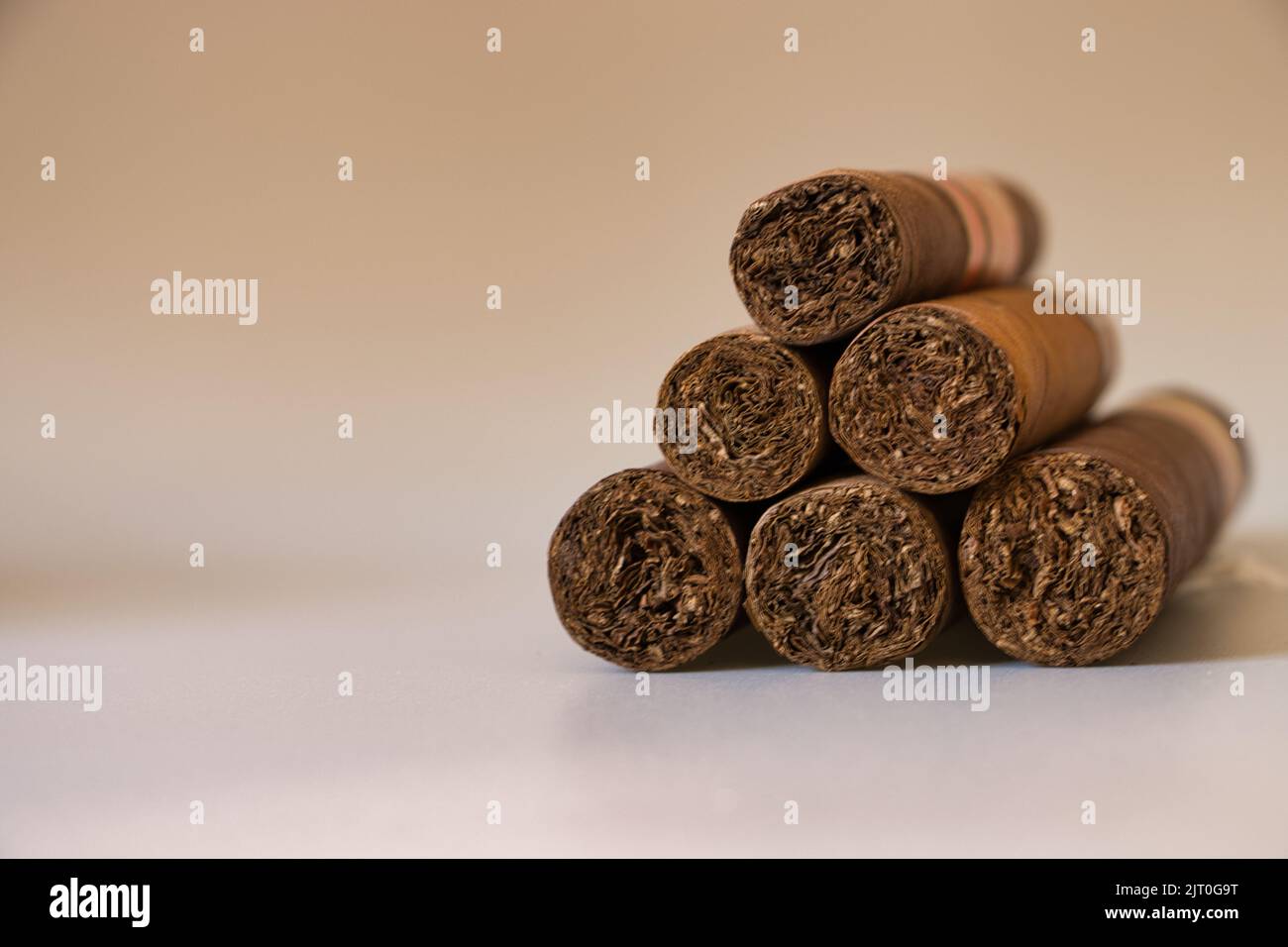 A pyramid stack of six Cuban cigars on the white background Stock Photo ...