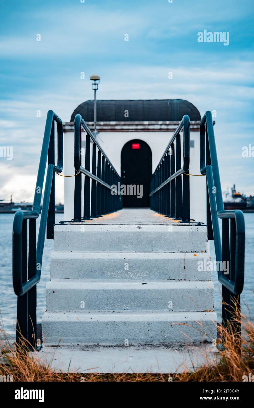 Vertical shot of stone staircase on bridge leading to entrance to ...