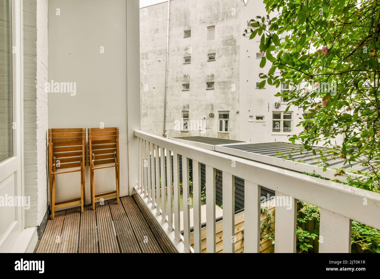 Sitting area in balcony with comfortable furniture around beautiful ...