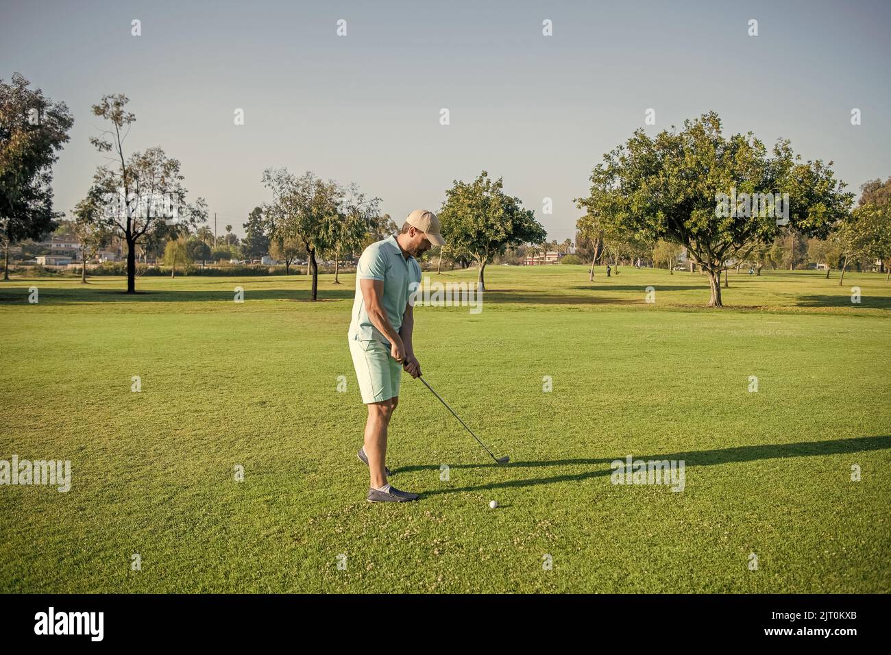 portrait of golfer in cap with golf club. people lifestyle. man playing ...