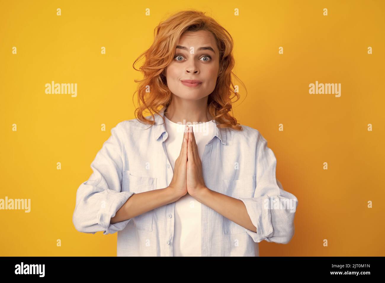 Portrait of happy woman smiling and saying prayer. Pretty girl enjoys ...