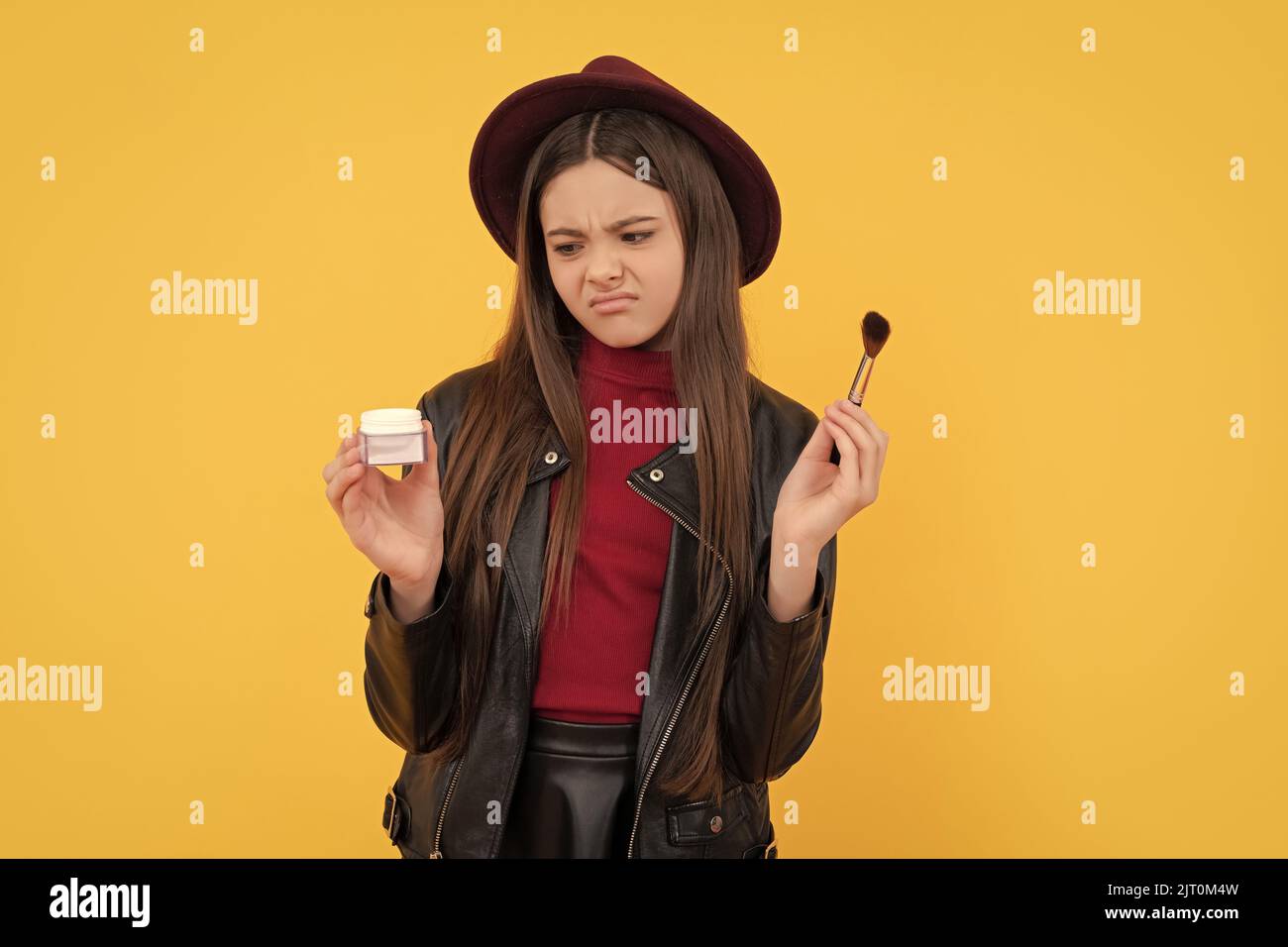 sad child apply face powder. teen girl hold blush. kid with makeup ...