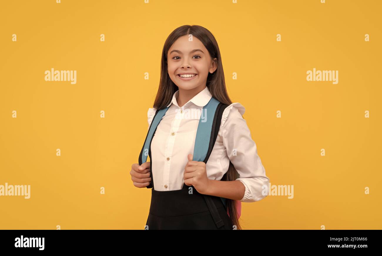cute child with school bag. happy teen girl carry backpack. back to ...