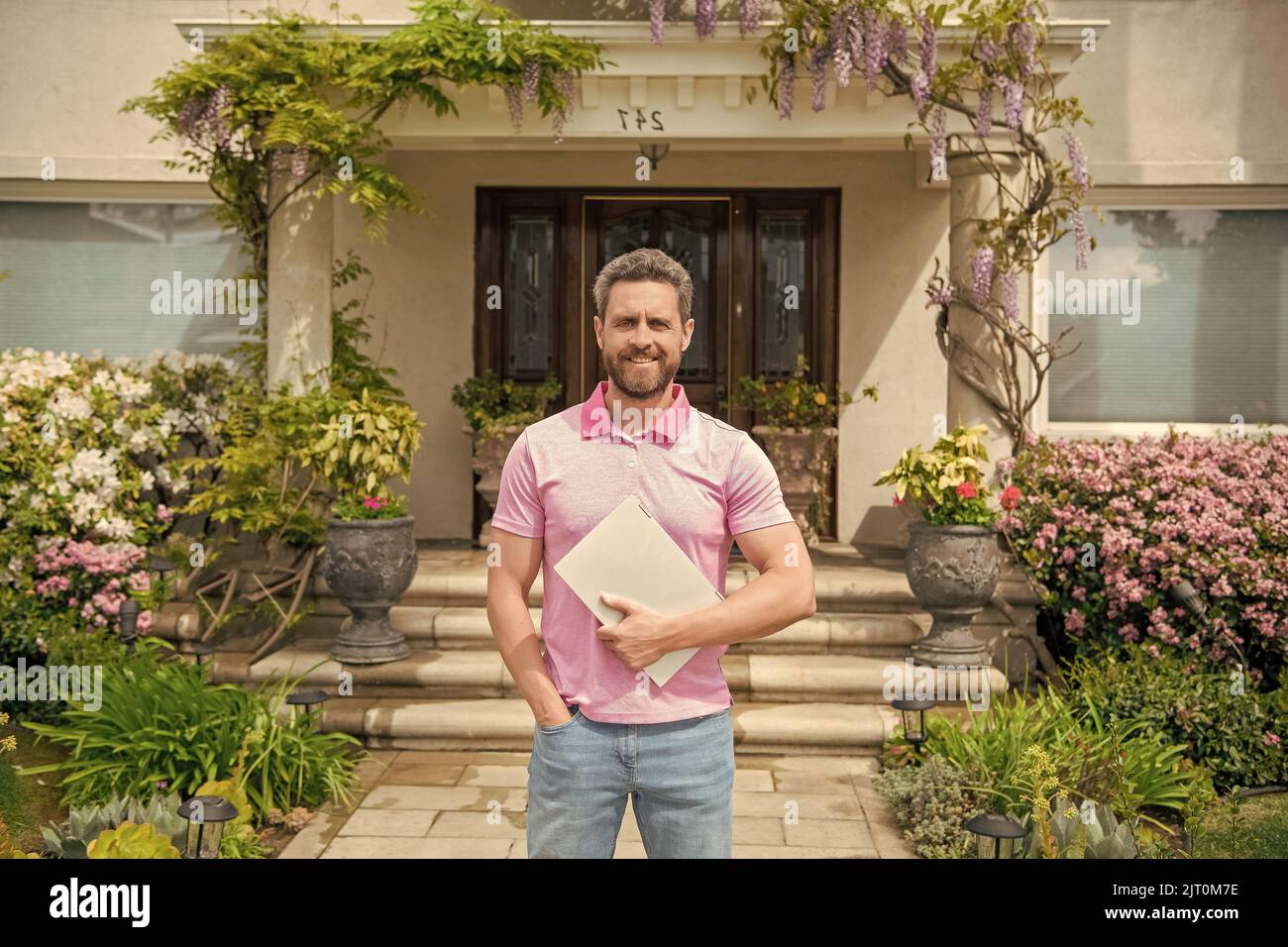realtor in suburb neighborhood. man purchasing house for investment ...