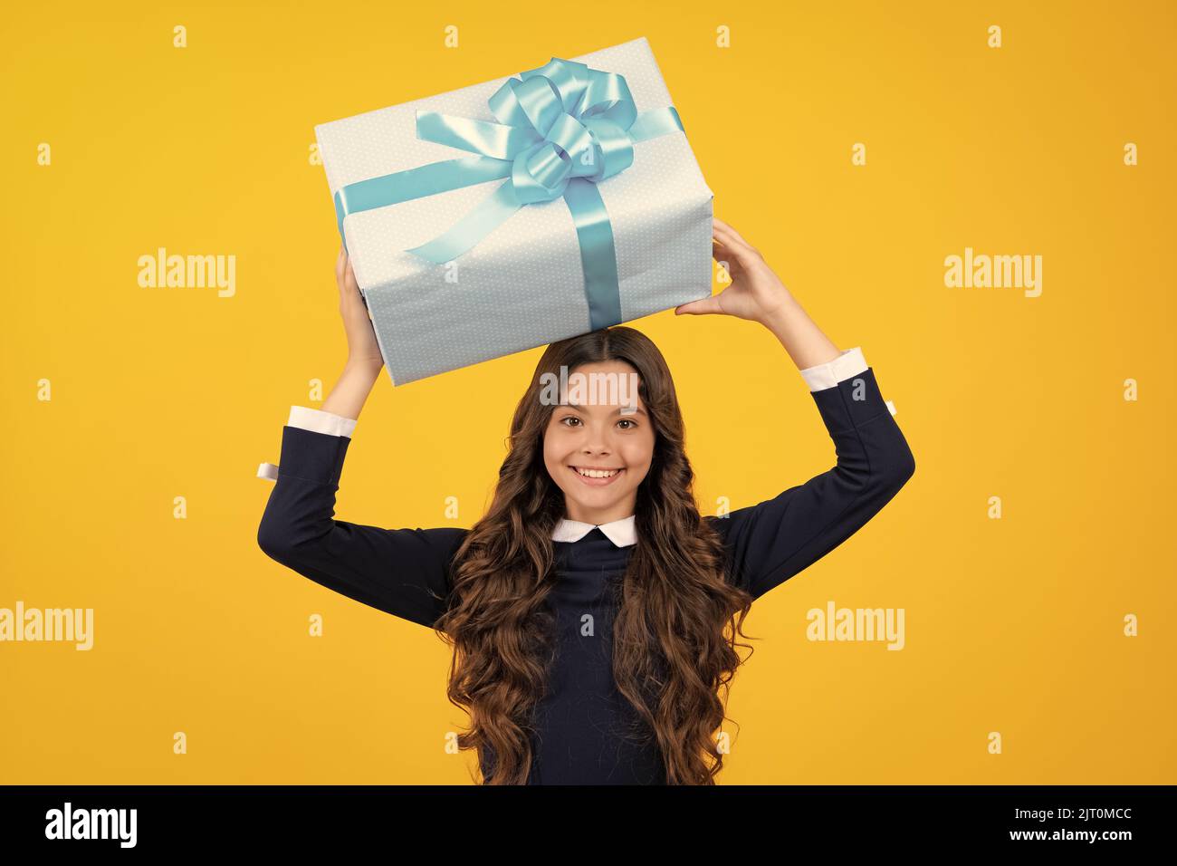 Teenager kid with present box. Teen child girl giving birthday gift ...