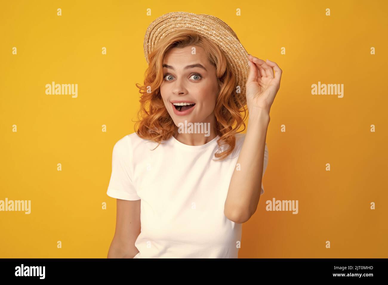 Expressive girl with surprised face. Beautiful woman in stylish straw ...