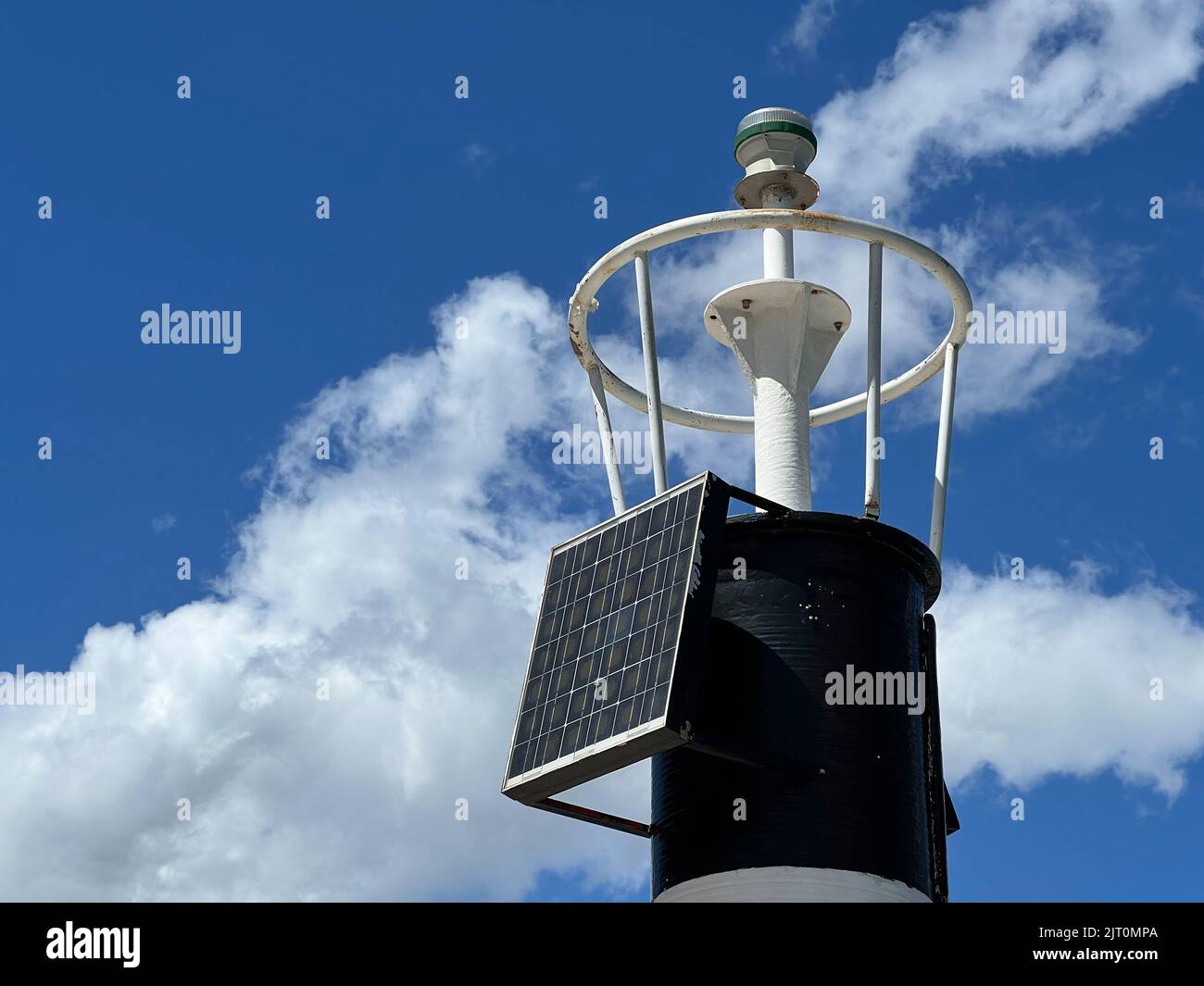 Top of the lighthouse against a cloudy sky Stock Photo - Alamy