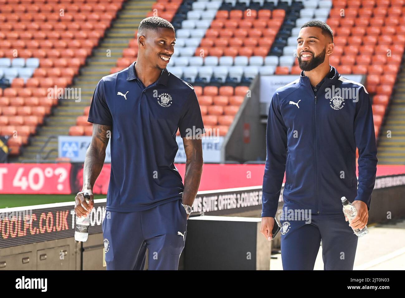 Marvin Ekpiteta #21 and CJ Hamilton #22 of Blackpool arrive at ...