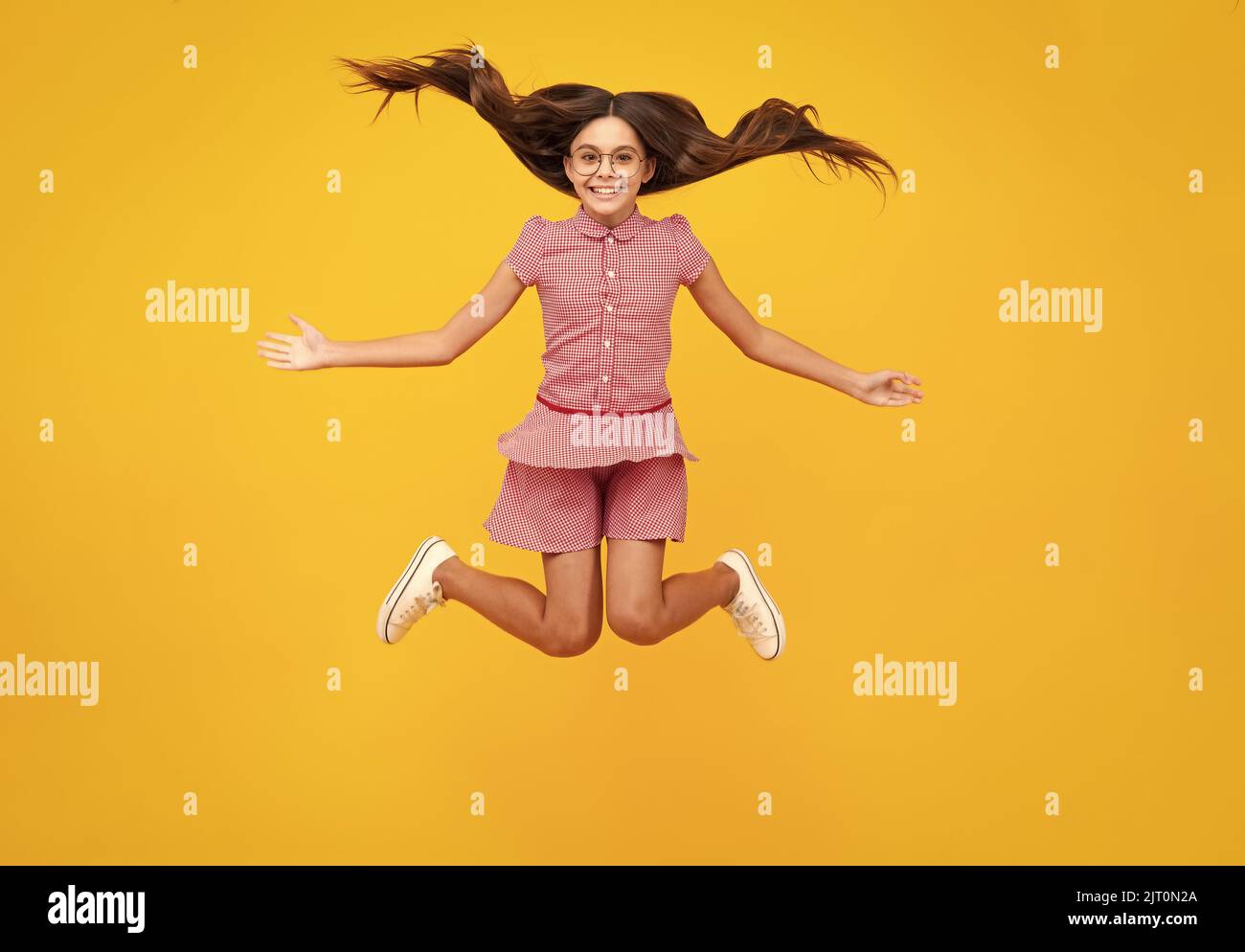 Full length cheerful teenager kid jump enjoy rejoice win isolated on ...