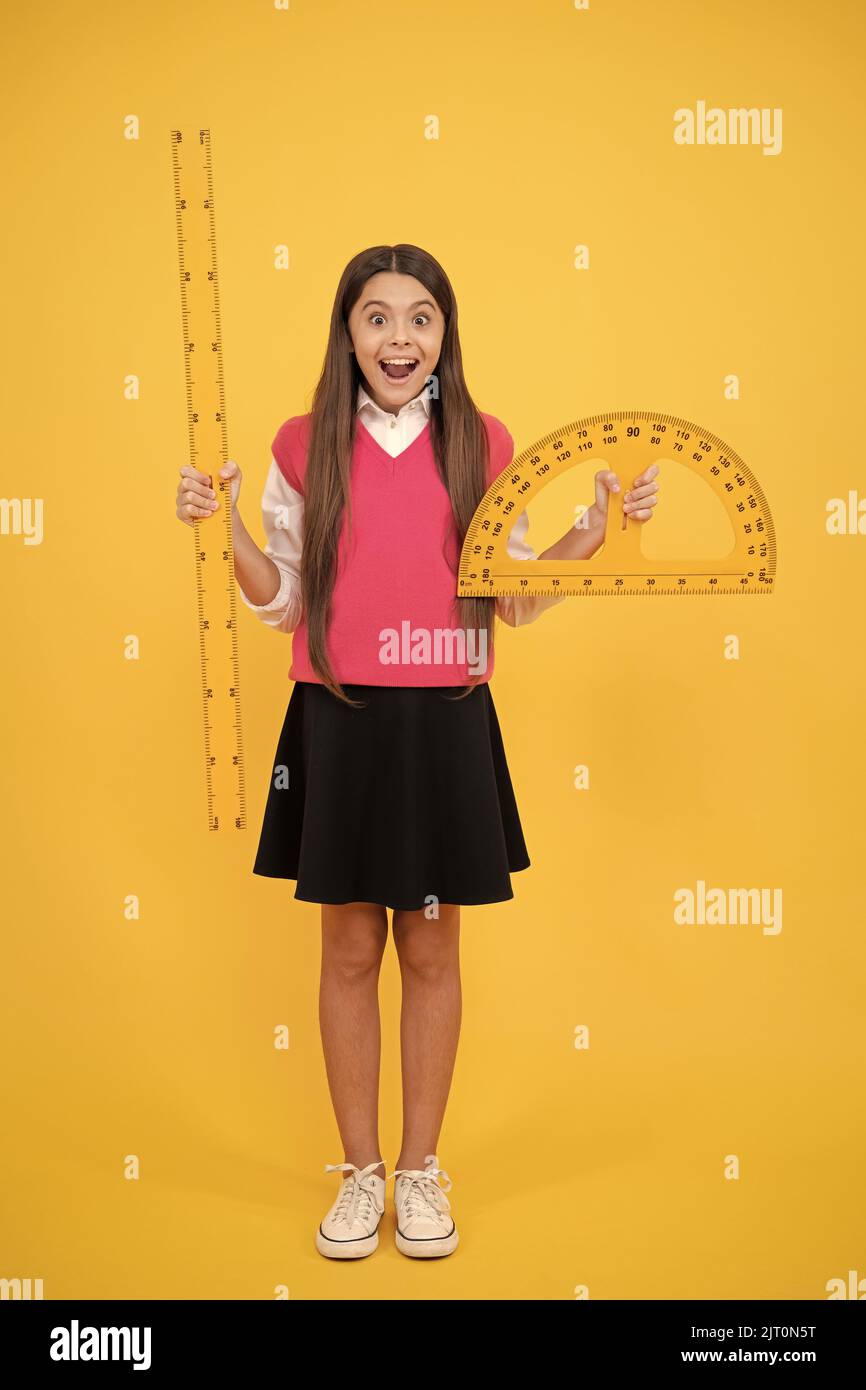 amazed child girl study geometry at school lesson with ruler, stem ...