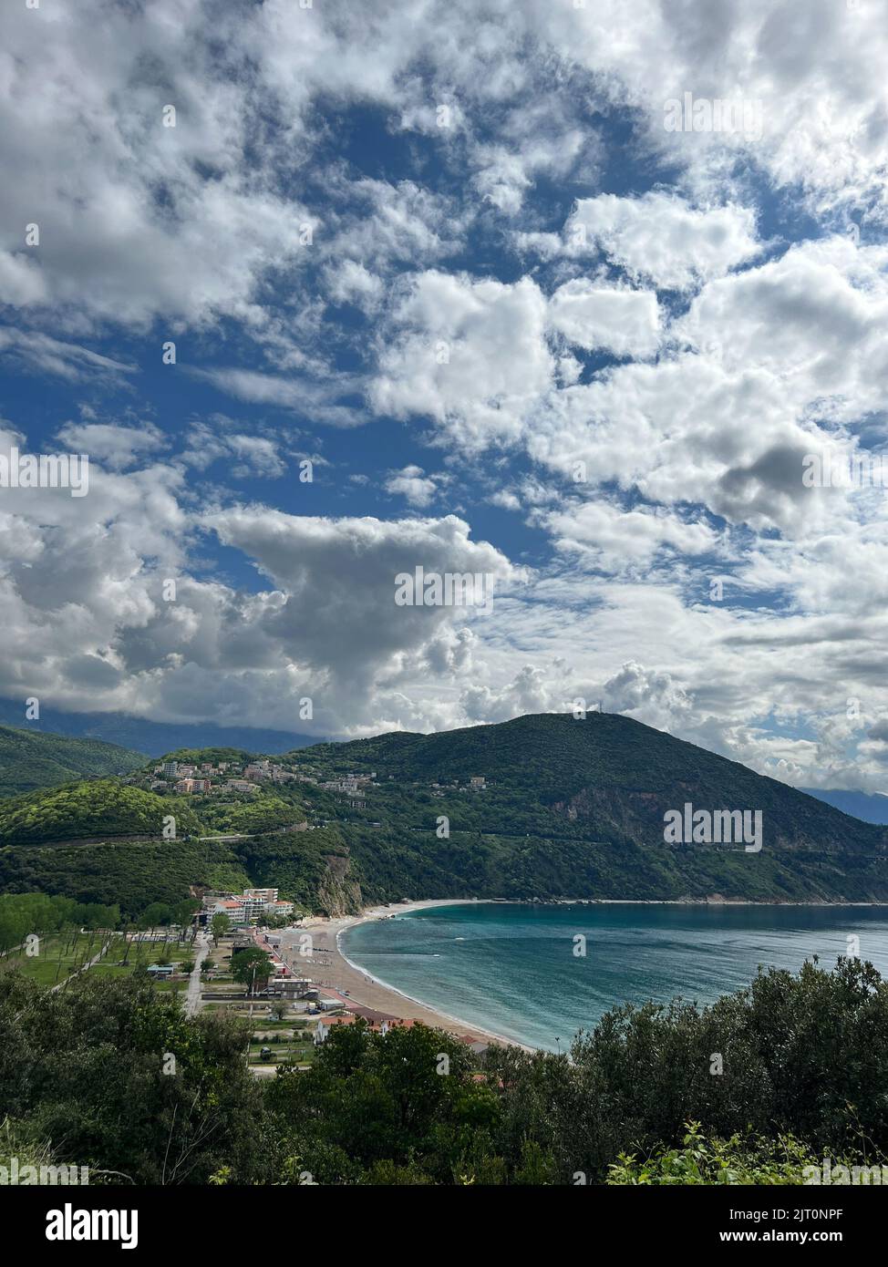 Jaz Beach surrounded by green mountains. Budva, Montenegro Stock Photo ...