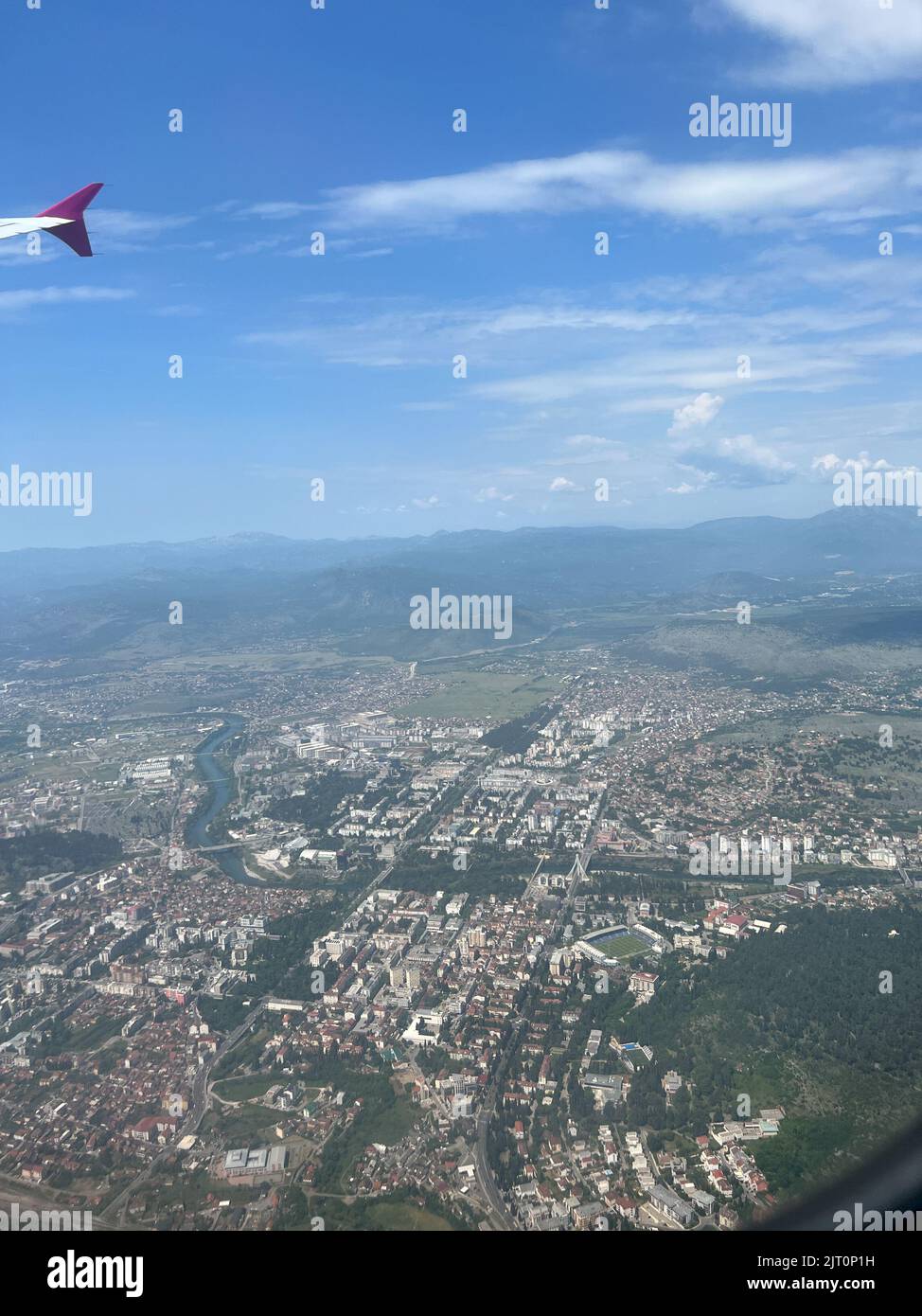 Roofs of high-rise buildings on the ground from an airplane window ...
