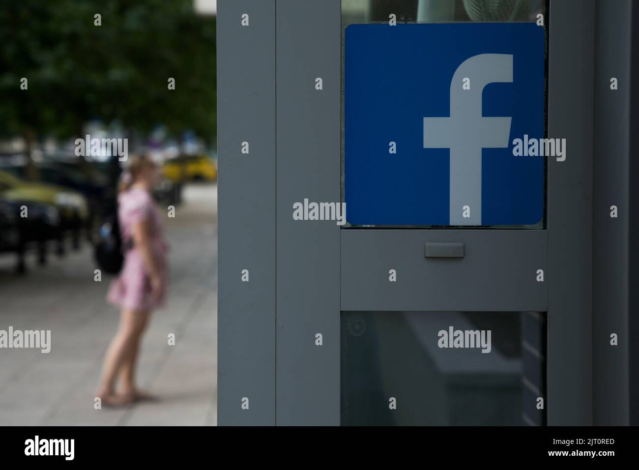 A Facebook logo is seen on a window of an office building in Warsaw ...