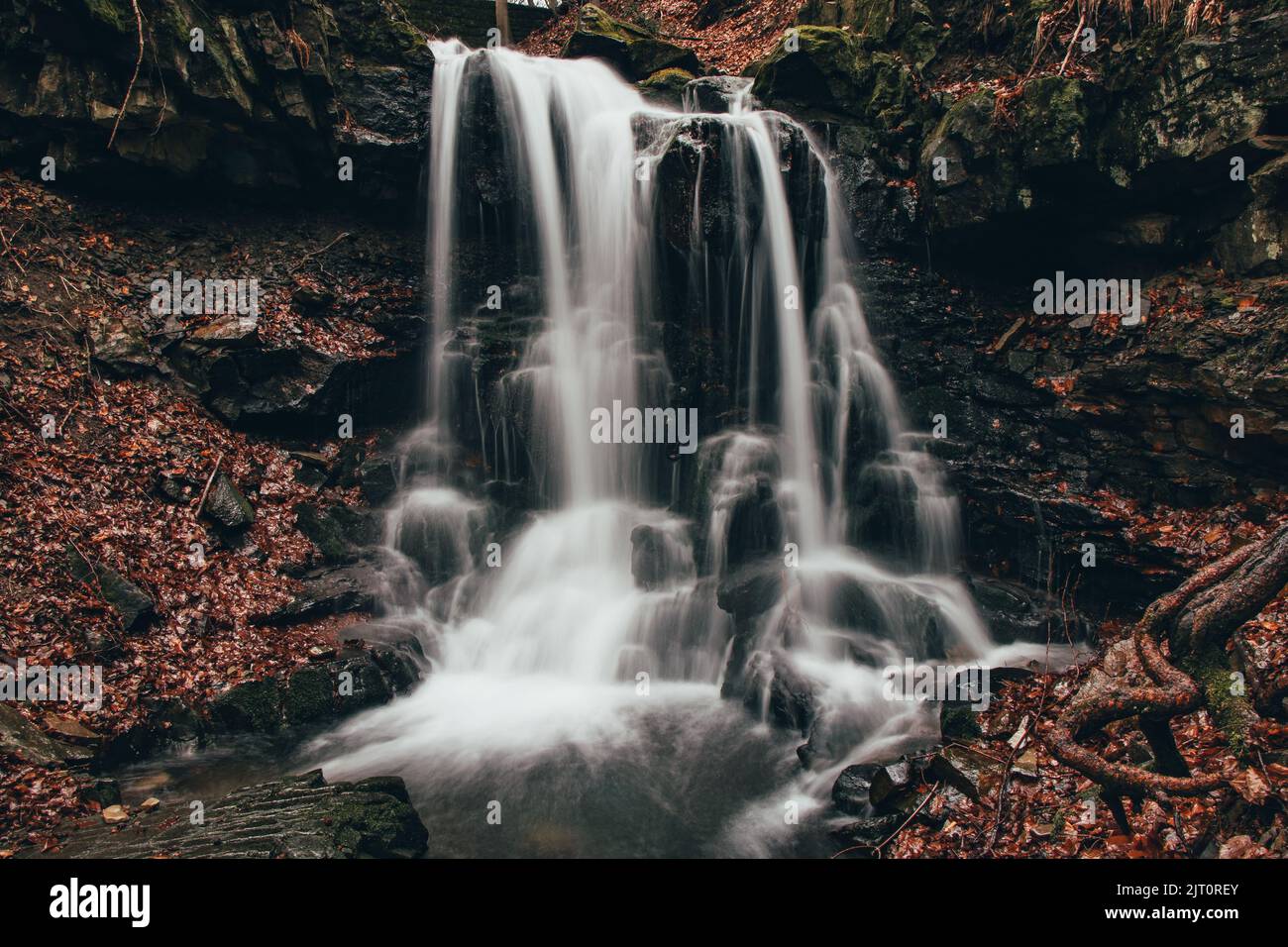 Frosty waterfall Tosanovsky in autumn colours in a beautiful unforgiving part of the Beskydy ...