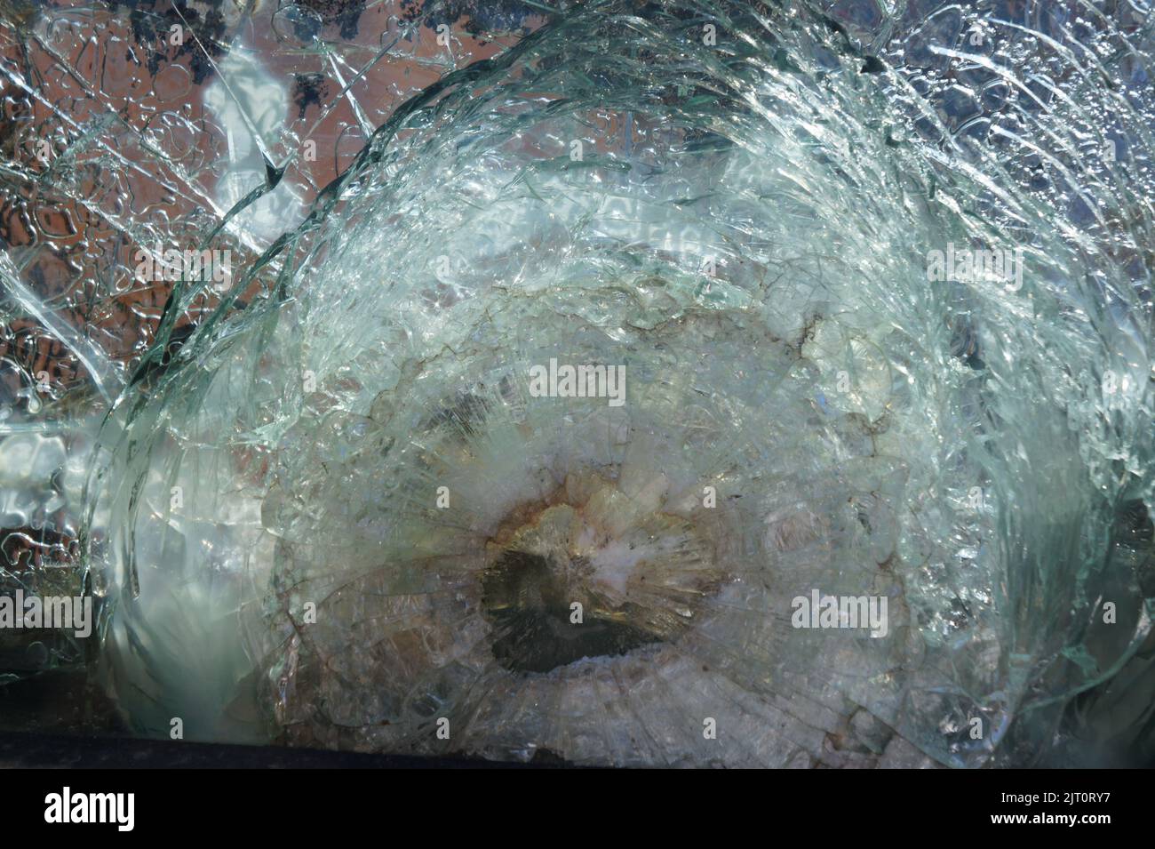 Armored glass after of a direct hit from an automatic weapon. Safety ...