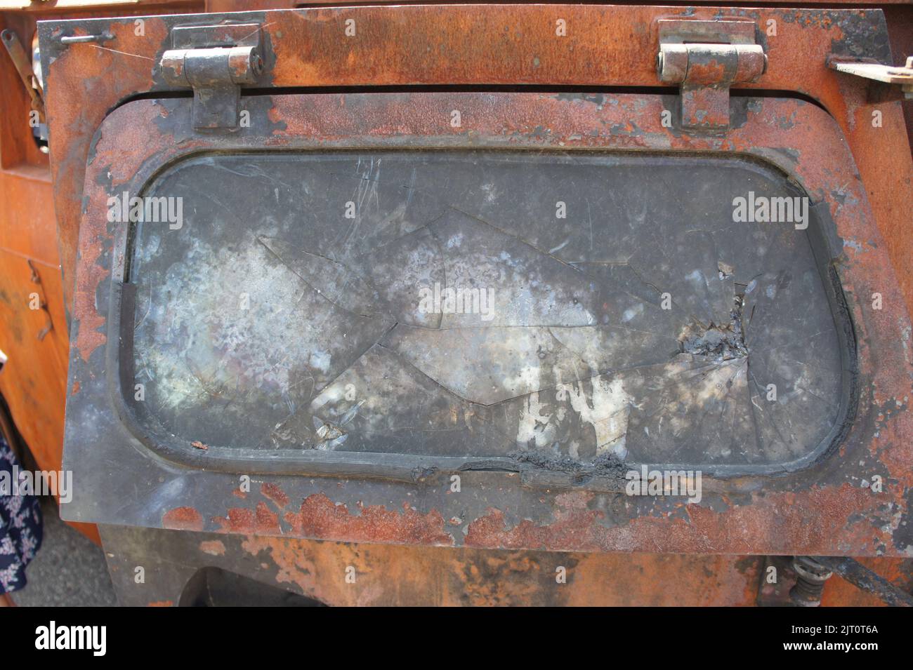 Armored glass after of a direct hit from an automatic weapon. Safety ...