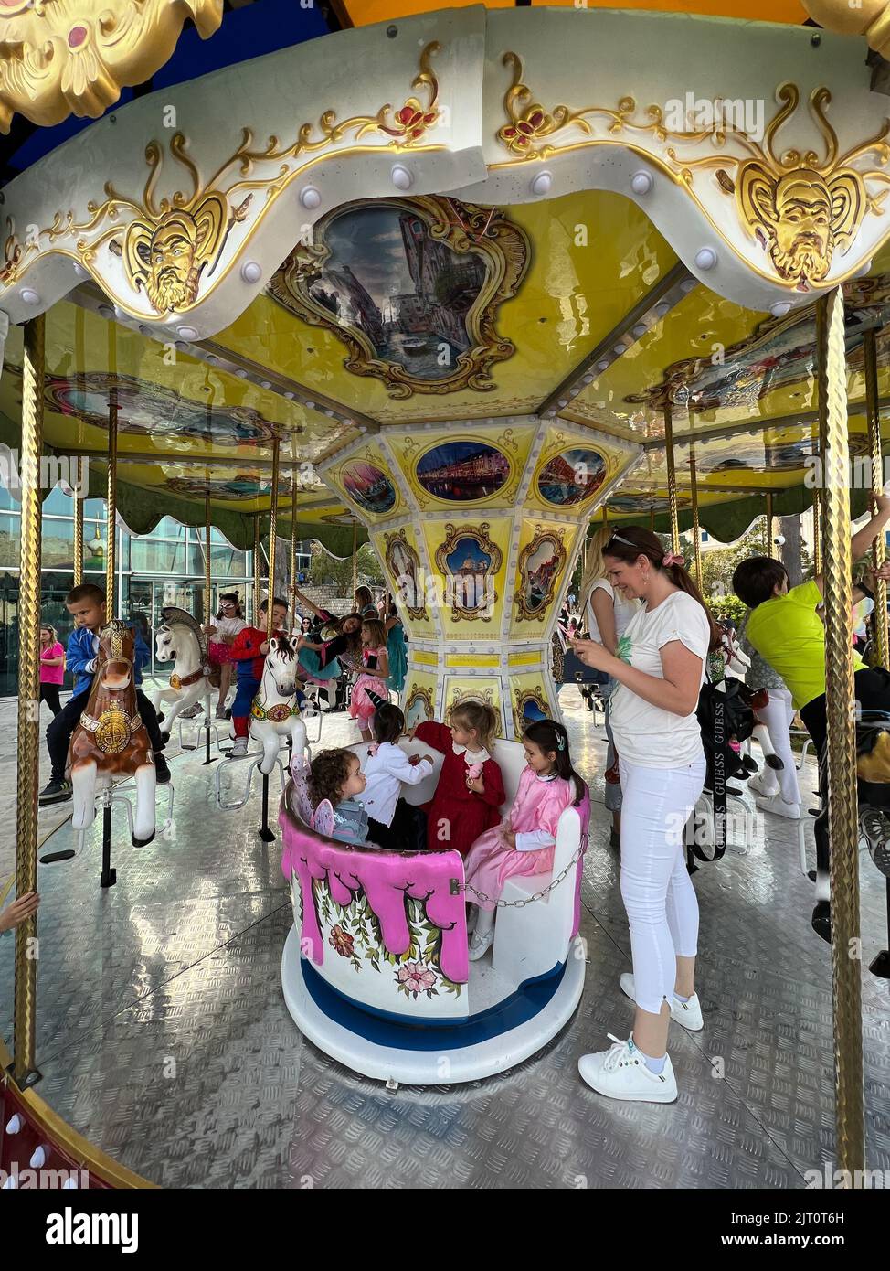 Budva, Montenegro - 07.07.22: Children ride on an Alice in Wonderland ...