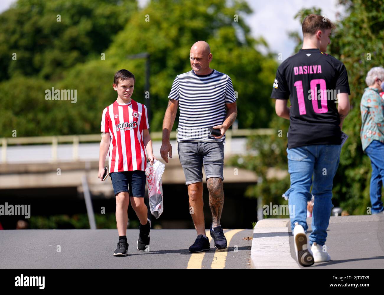 Brentford fans arrive ahead of the Premier League match at the Gtech ...