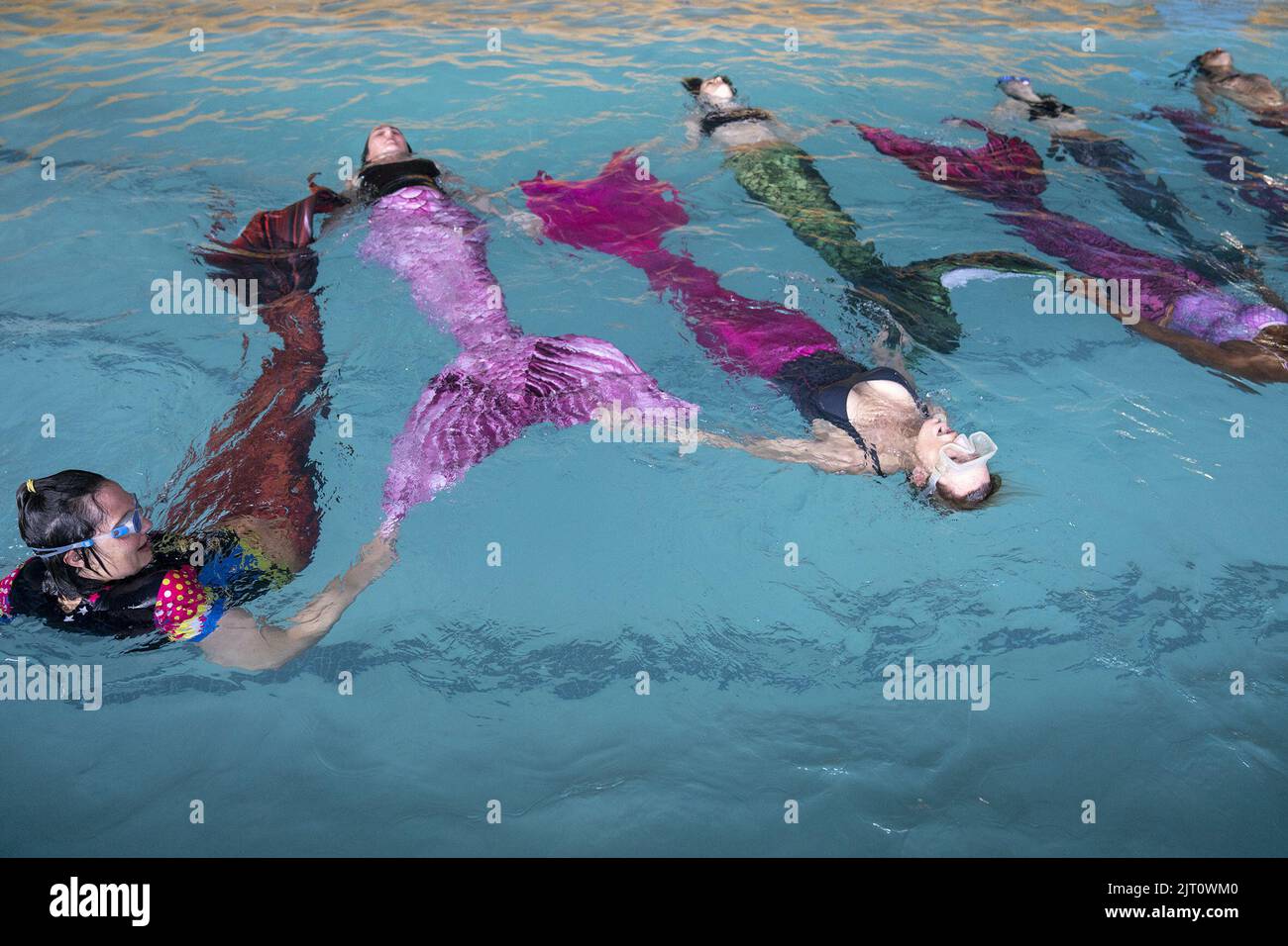 Johannesburg, South Africa. 26th Aug, 2022. Trainees practise mermaid ...