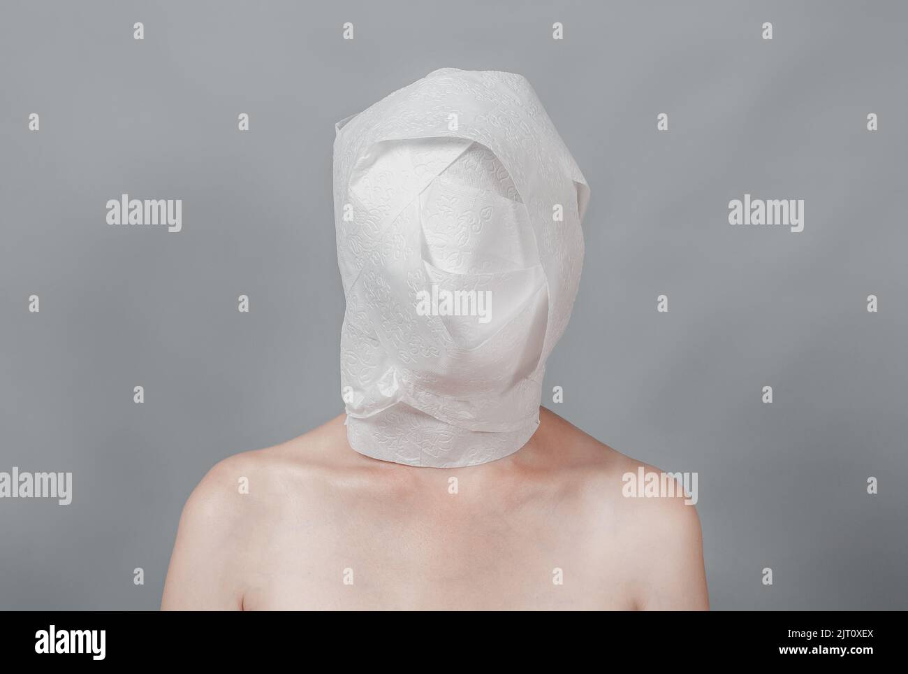 The head is wrapped in white toilet paper. Mummy, mental health concept ...
