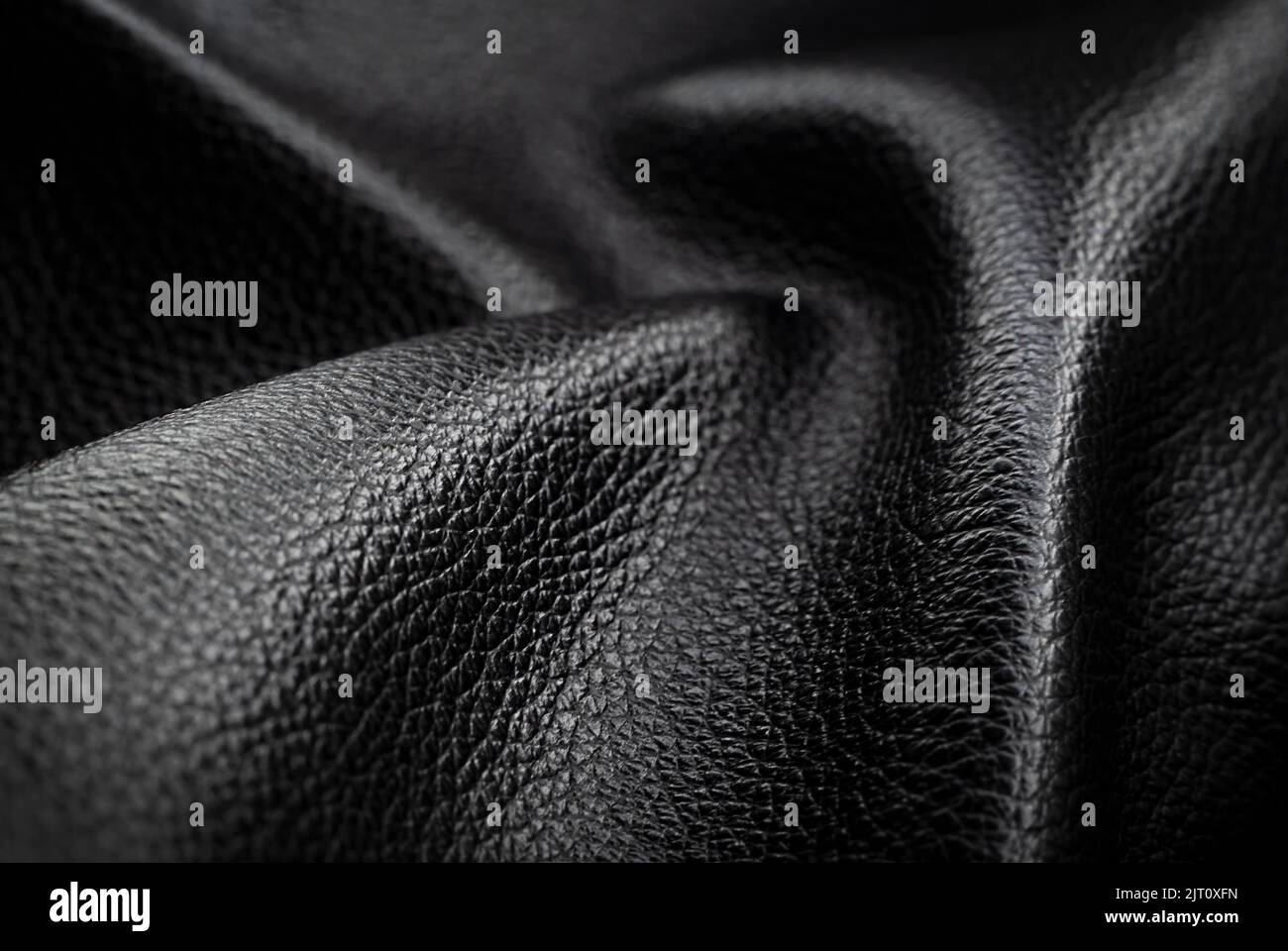Black leather texture. Abstract background of dark leather with small ...