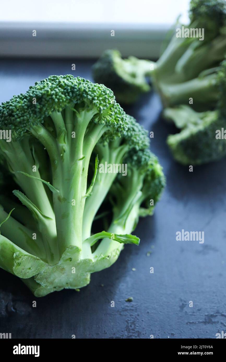 Broccoli florets on a dark background Stock Photo - Alamy