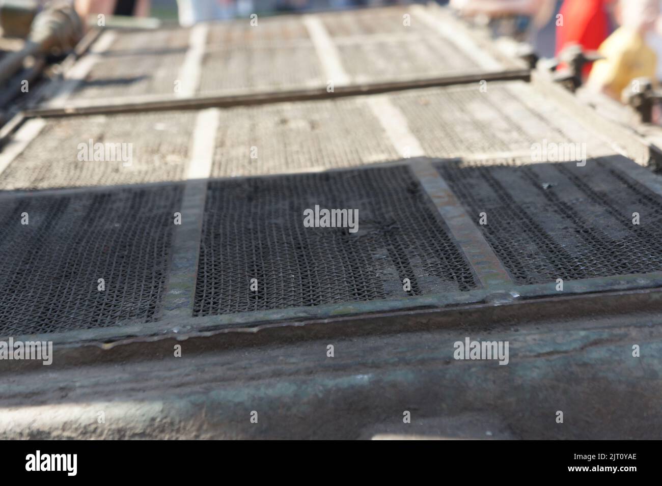 Lattice texture close up. Holes of grey metal plate with round regular ...