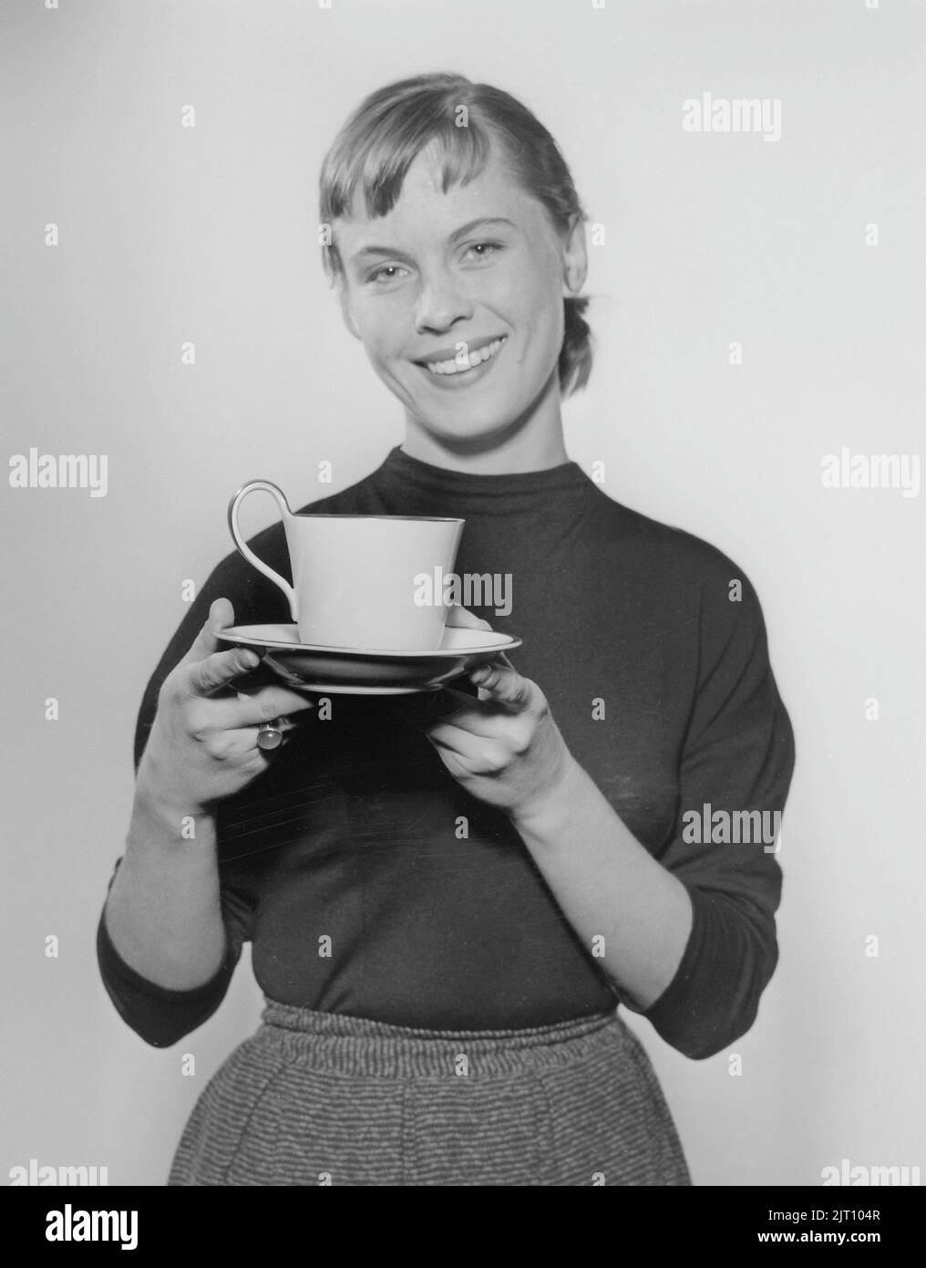 In the 1950s. A woman holds a large porcelain cup in her hands. Sweden ...