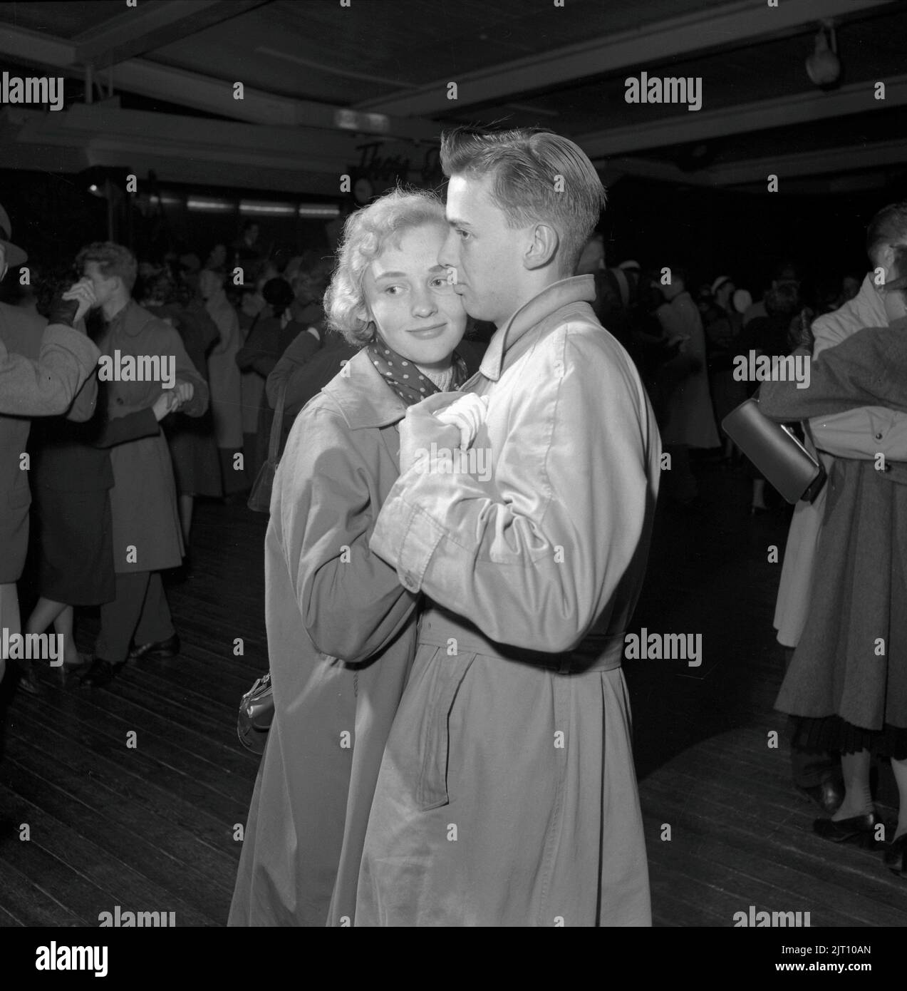 Dancing in the 1950s. A young couple is dancing and moving to the music ...
