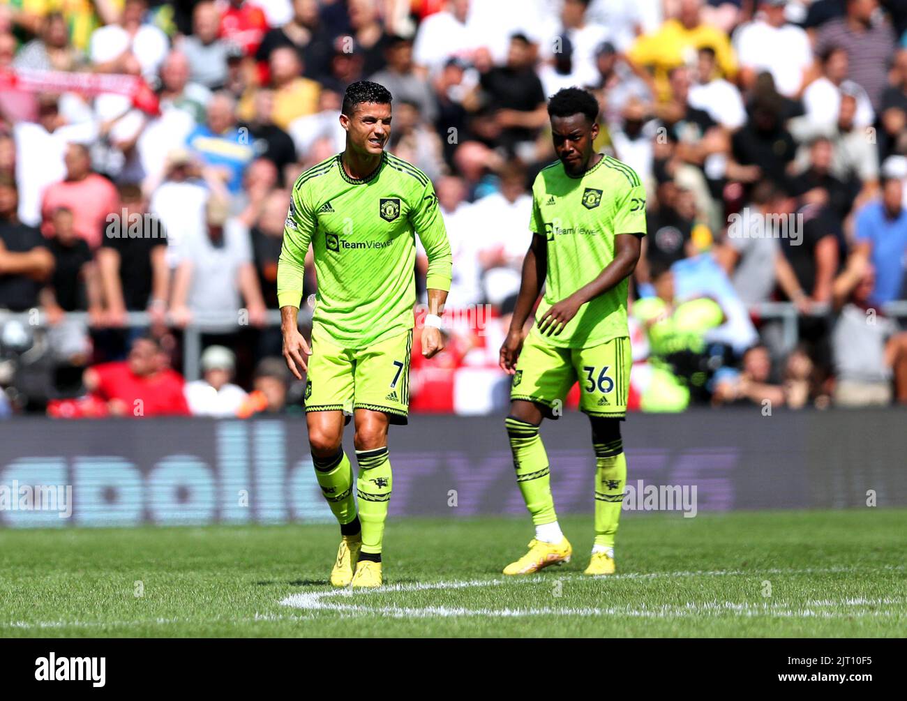 Manchester United's Cristiano Ronaldo (left) reacts after picking up an ...