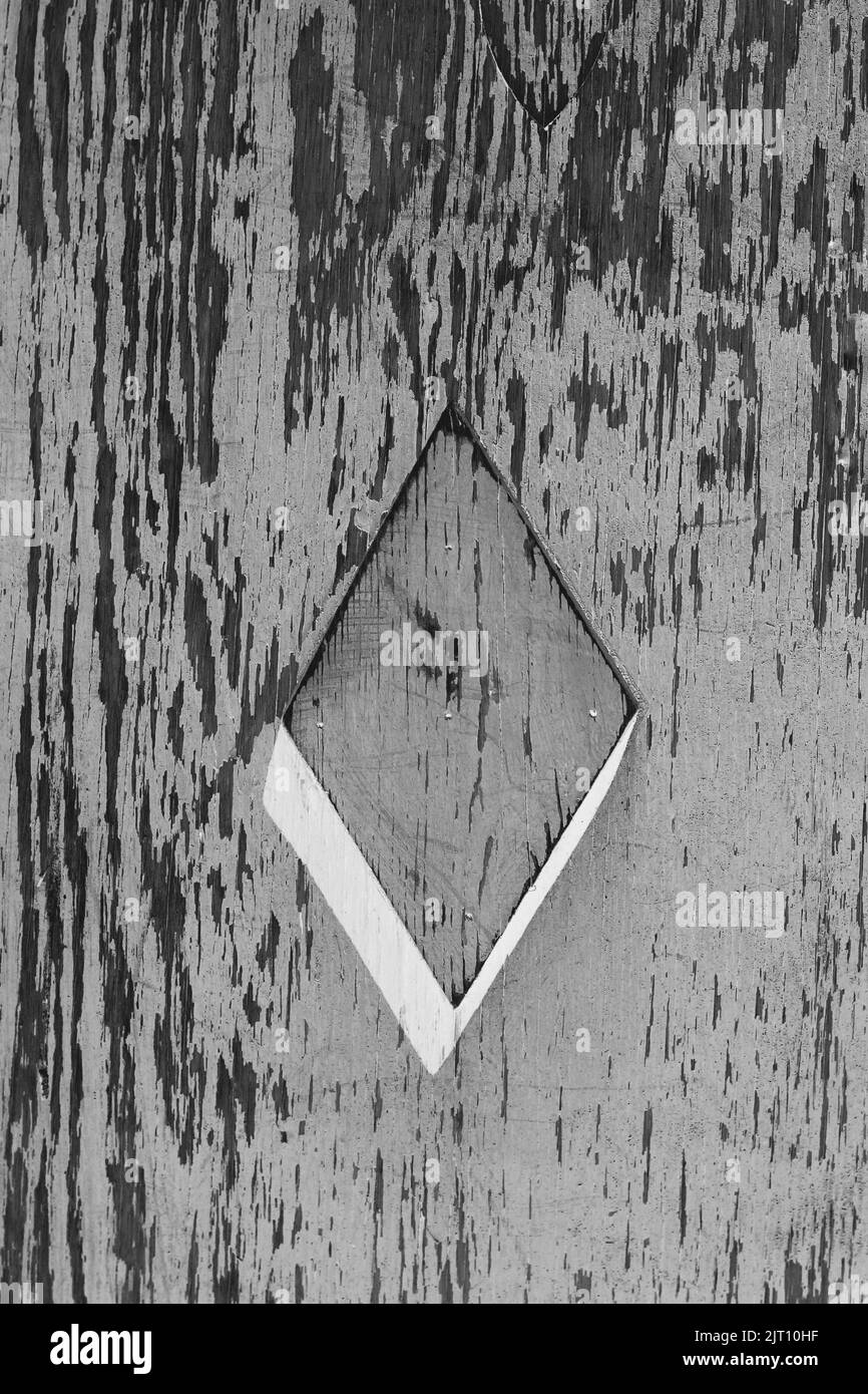 Simple diamond shape cut out of a plank of wood as decoration for a ...