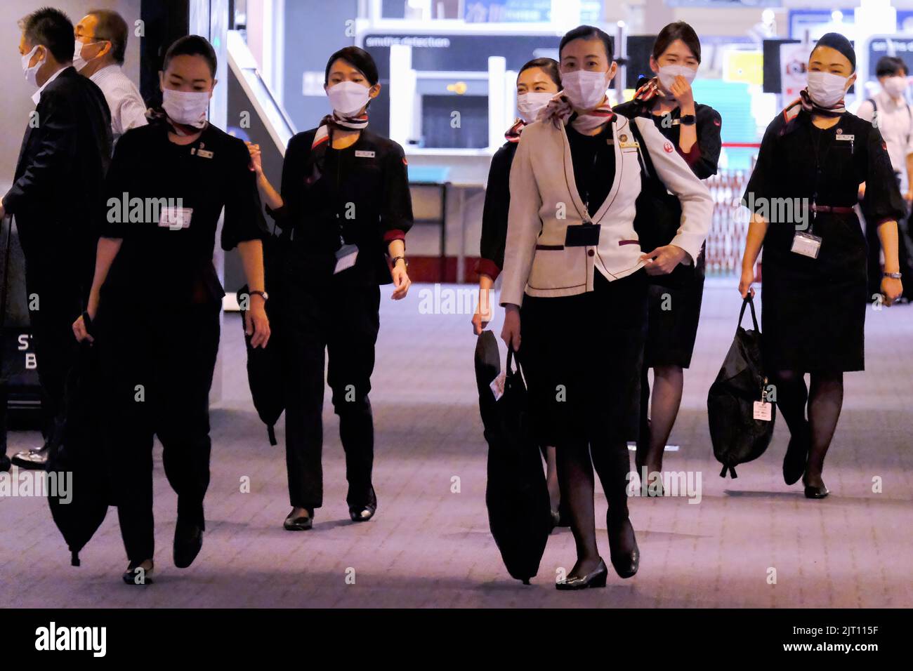 Tokyo, Japan. 25th Aug, 2022. Employees of Japan Airlines (JAL) wearing ...
