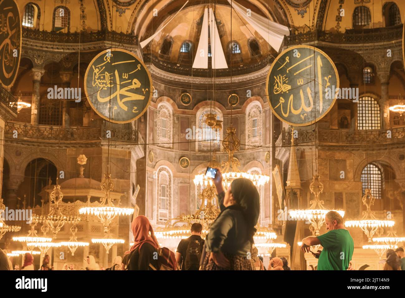 Travel to Istanbul concept. Tourist taking photo of Hagia Sophia or Ayasofya mosque. Noise ...