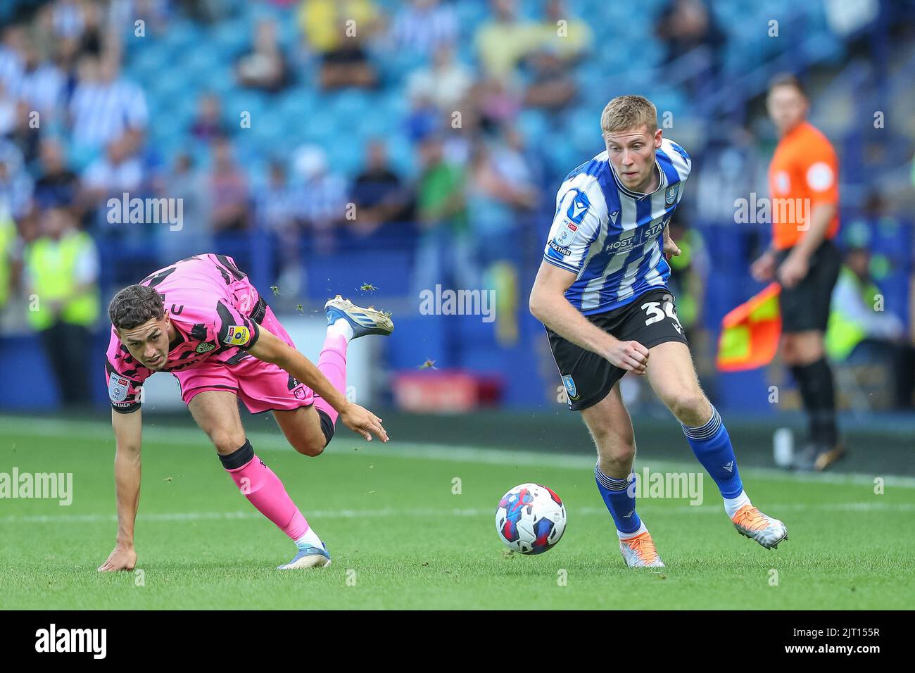 Mark McGuinness #34 of Sheffield Wednesday gets past Corey O'Keeffe #2 ... Mark McGuinness #34 of Sheffield Wednesday gets past Corey O'Keeffe #2 ...