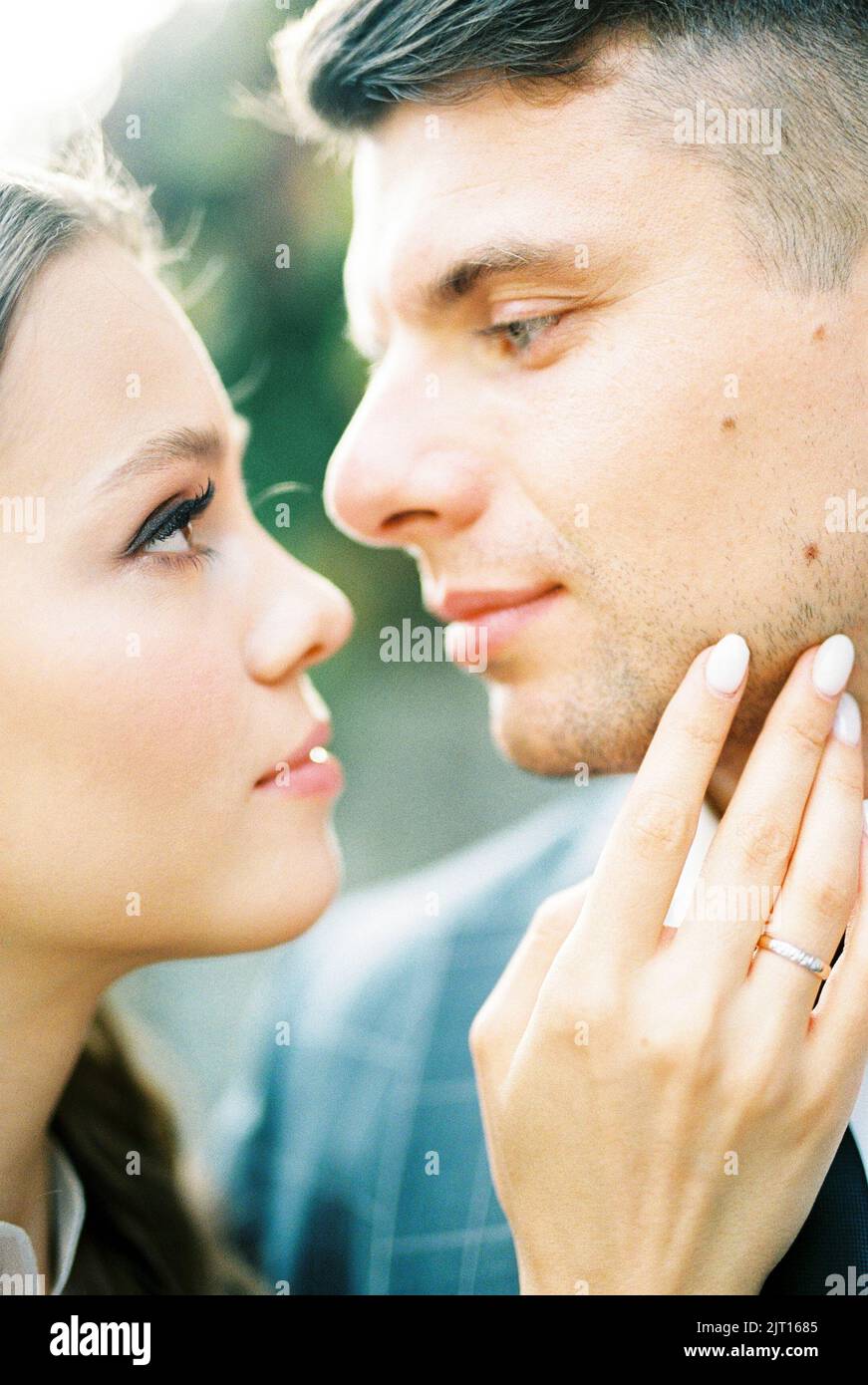 Woman touches man face with her hand. Close-up Stock Photo - Alamy