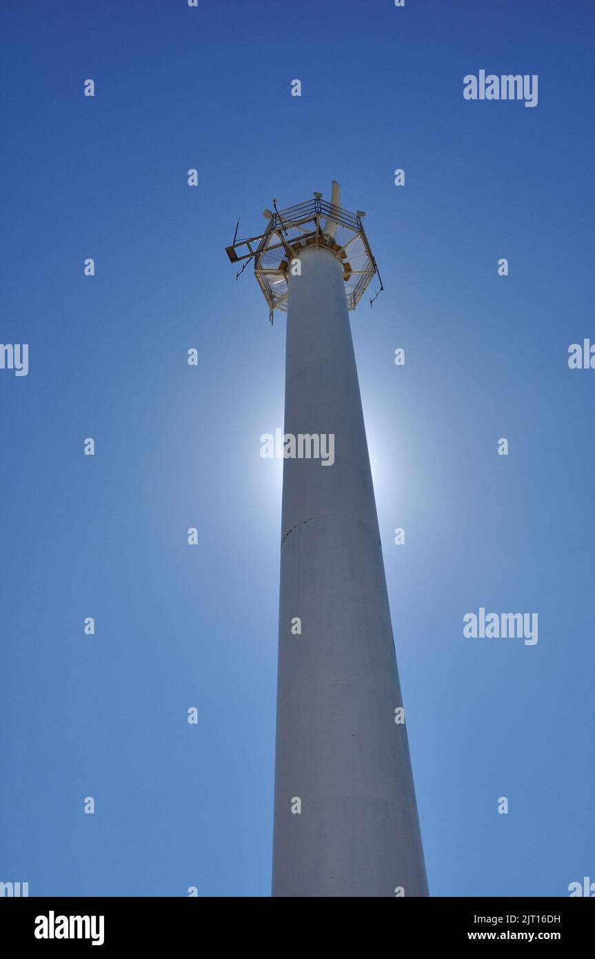 Sun behind the tall Radar Tower at Landguard Point, Felixstowe, Suffolk ...