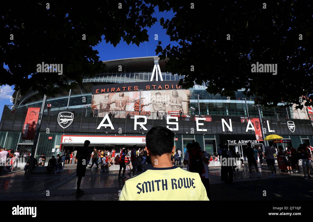 Arsenal fans make their way to the stadium before the Premier League ...