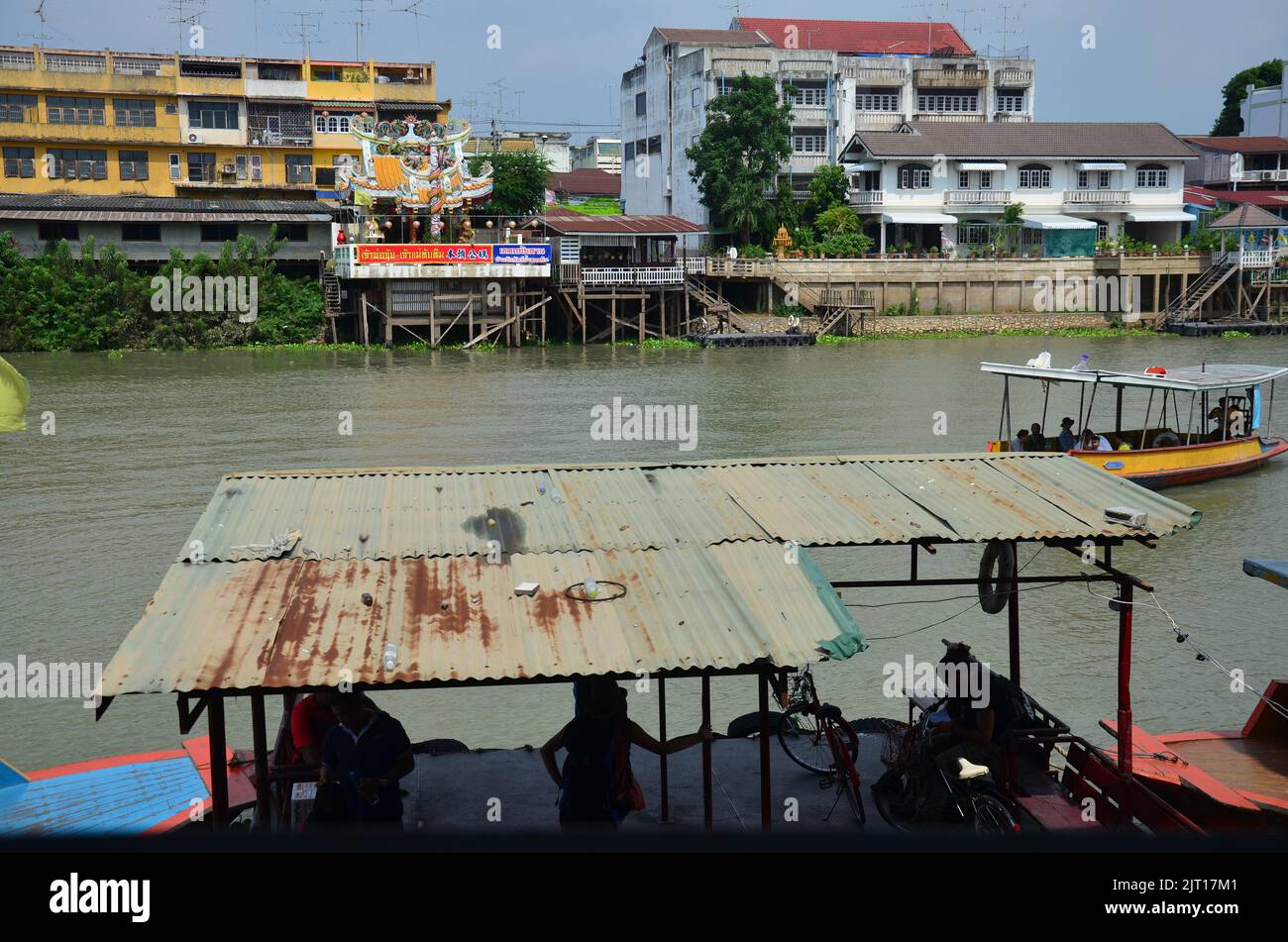 Local boat ship ferry transport stop at port pier send receive thai ...