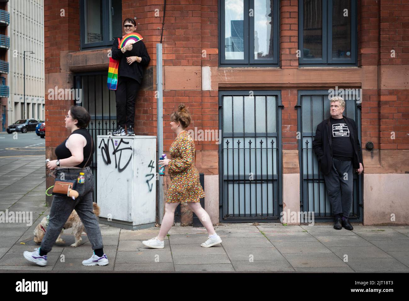 Manchester, UK. 27th Aug, 2022. People watch the Pride Parade pass ...