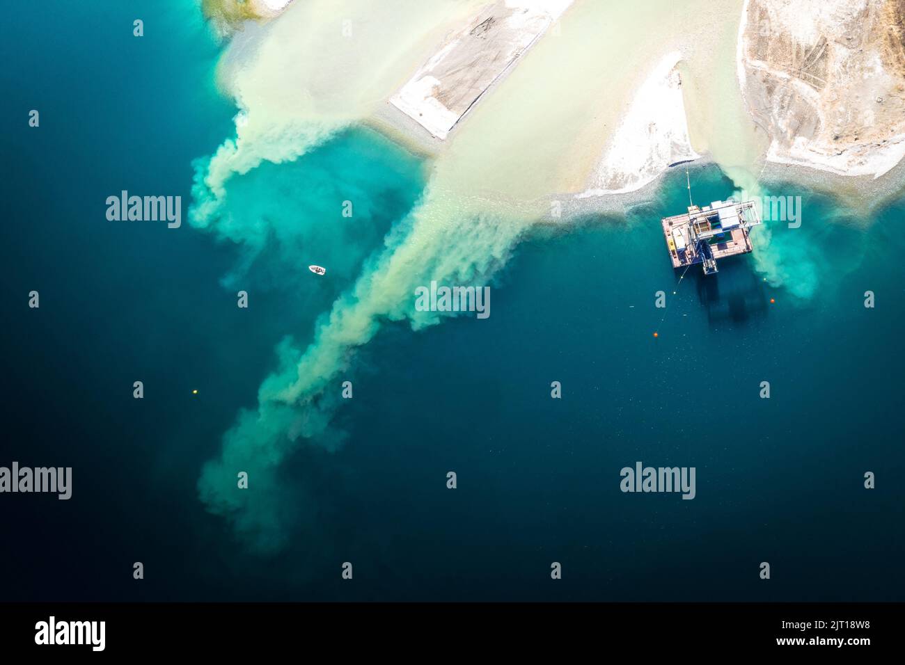 An aerial view of water pollution flowing on the sea Stock Photo - Alamy