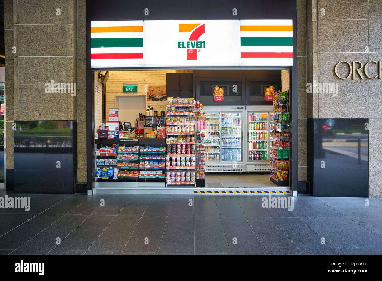 SINGAPORE - CIRCA JANUARY, 2020: cash desk and goods on display at 7-eleven convenience store in ...