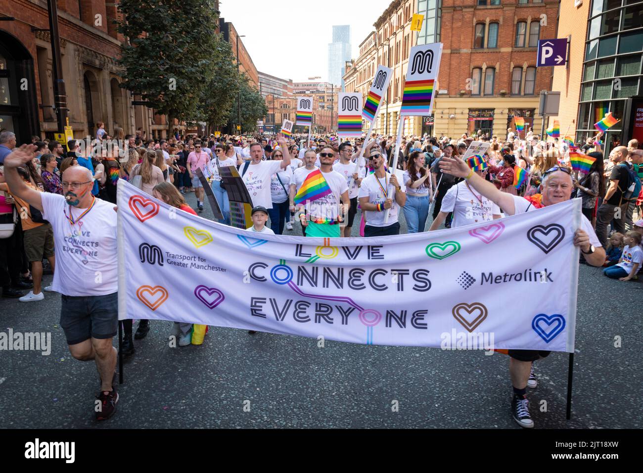 Manchester, UK. 27th Aug, 2022. Employees from TFGM march behind a ...