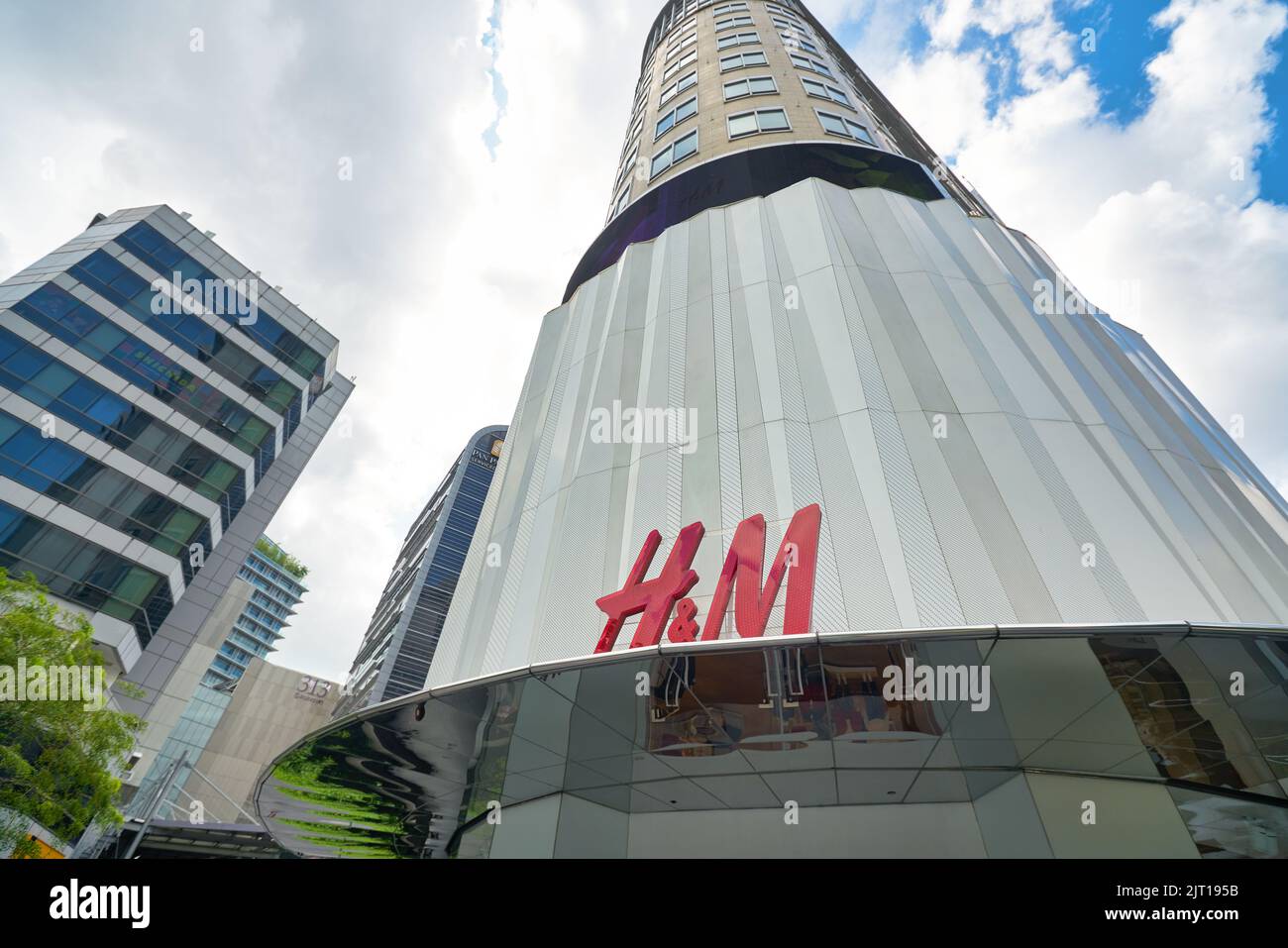 SINGAPORE - JANUARY 19, 2020: H&M brand name over store entrance in Singapore. H&M is a Swedish ...